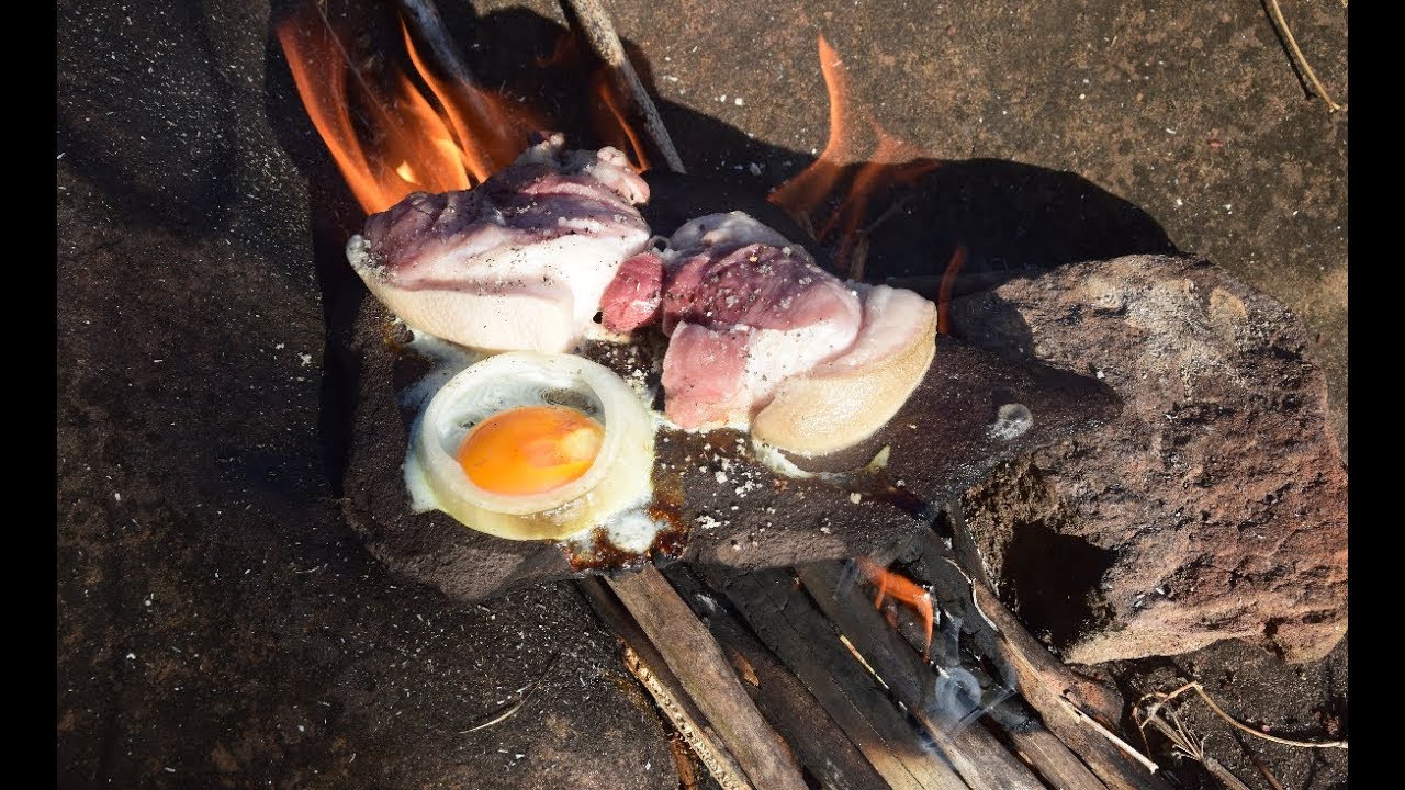 Primitive Cooking Meat On A Stone - YouTube