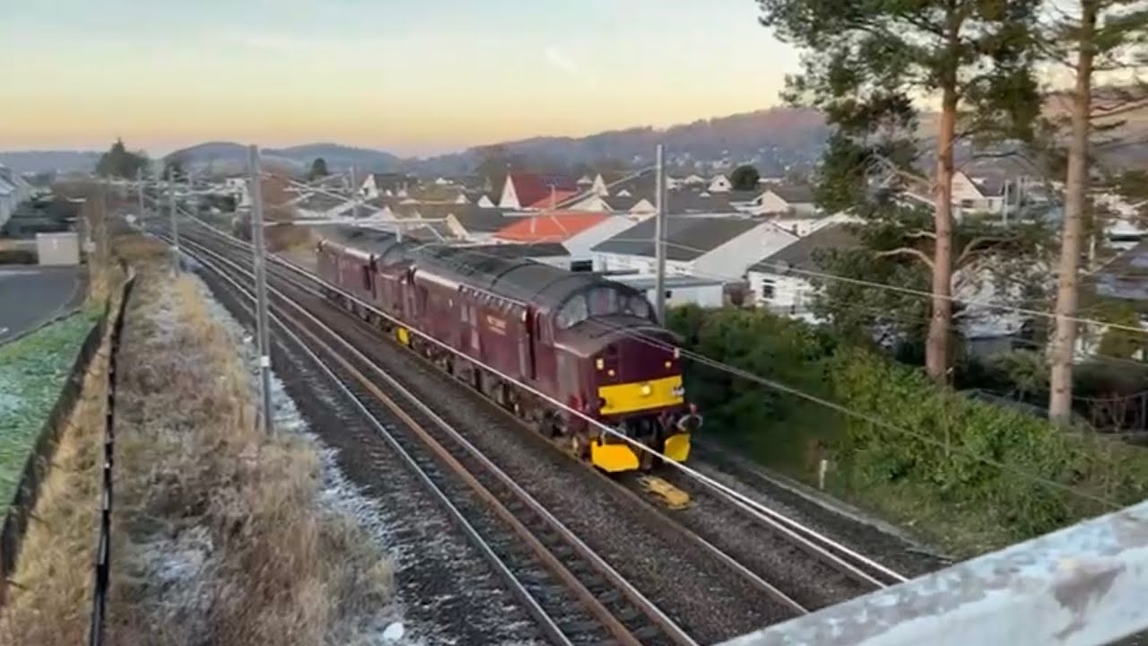 (Filmed by a relative) WCR class 37s pass Stirling bridge at speed with ...
