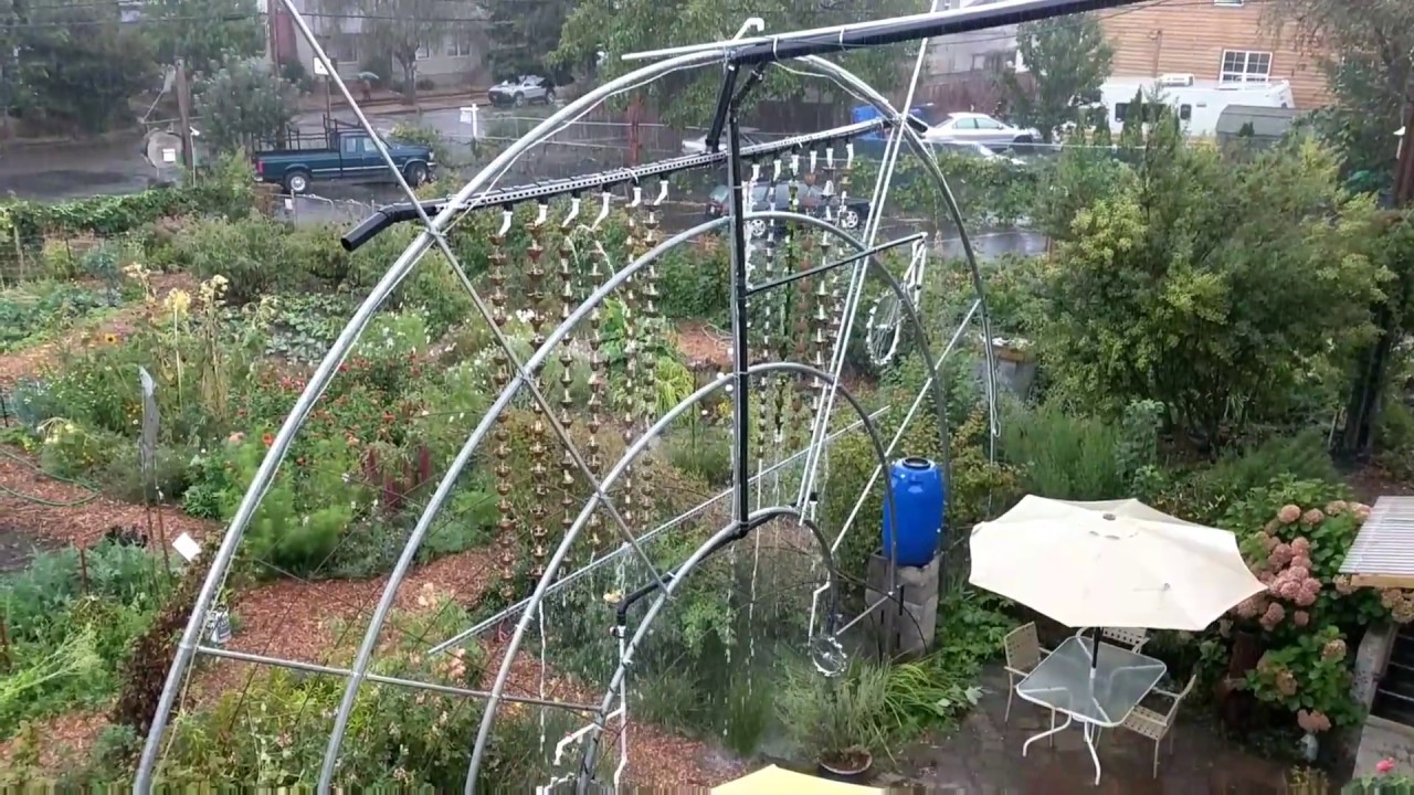Kailash Ecovillage kinetic rainwater sculpture during a downpour - YouTube