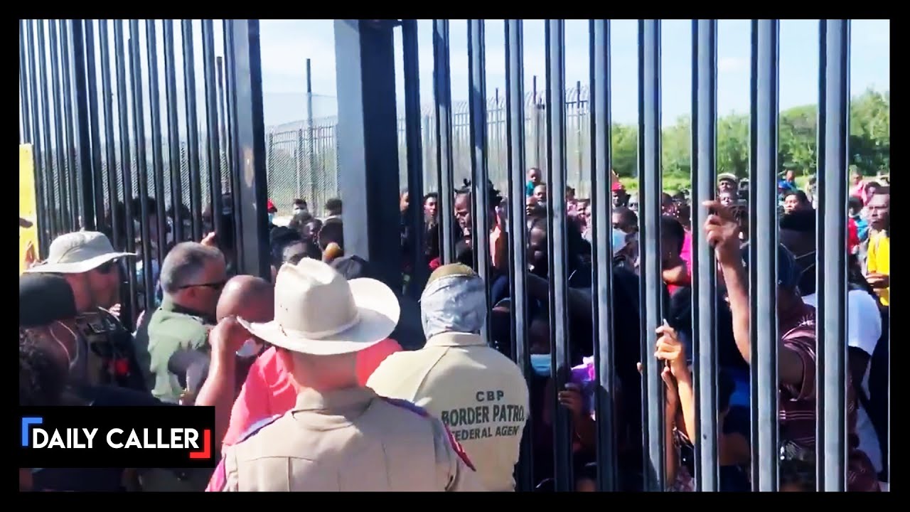 Video Shows Hundreds Of Migrants Swarm Through Border Gates ...