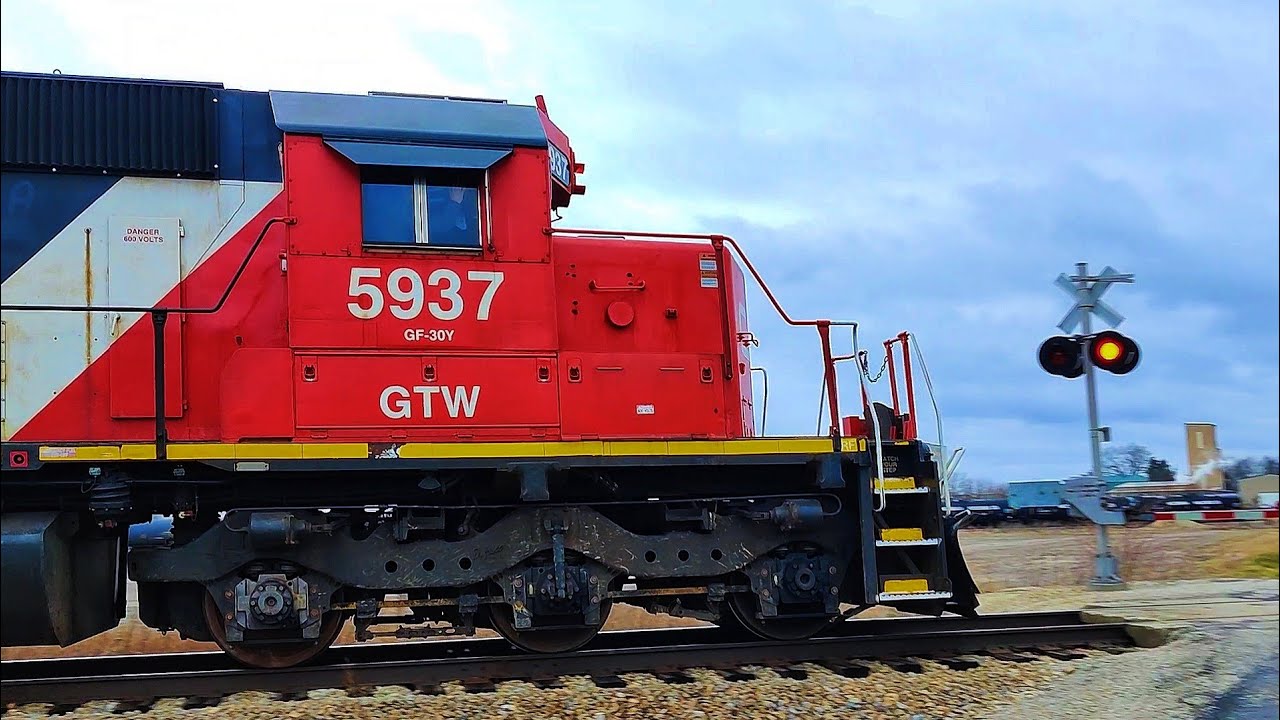 ex-GTW CN GF-30Y #5937 & IC #3107 lead a local from Gibson City in Gilman Illinois (to ...