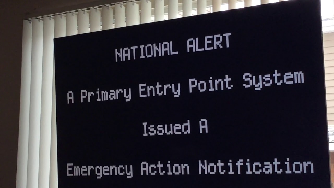 Watching a EAS scenario on TV of a emergency action notification ...