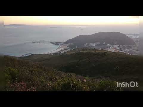 A view of the sunset in the sky of Dalia beach in Morocco, overlooking ...