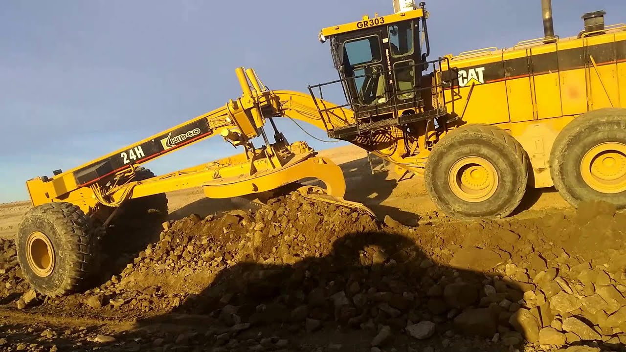 CAT 24 Grader Trimming Rock Slope - YouTube