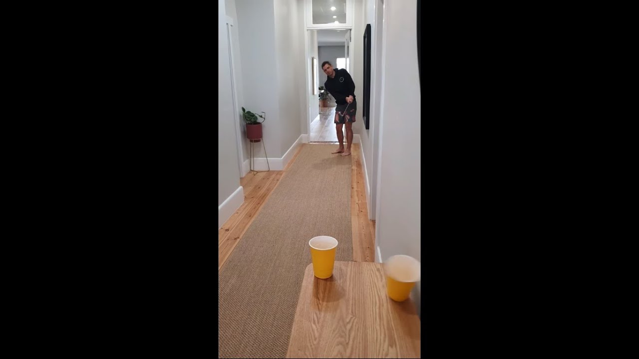 Man Makes A Cup Slide For A Hallway Golf Trickshot - YouTube