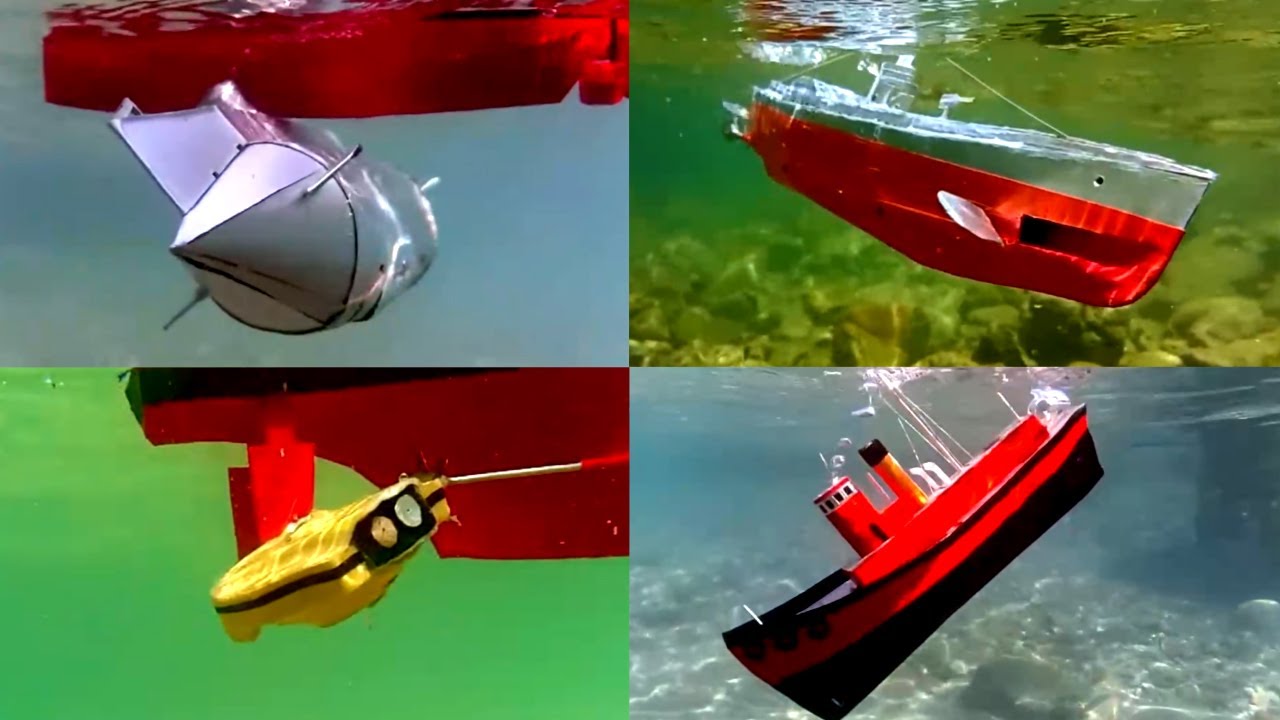 Submarines in action, model submarines moving past underwater rocks ...