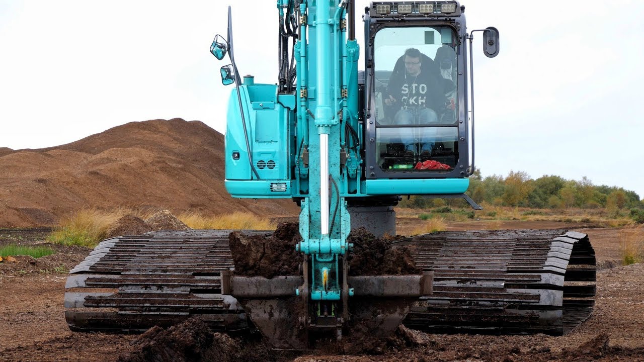 Kobelco Excavators with Super Wide Tracks - YouTube