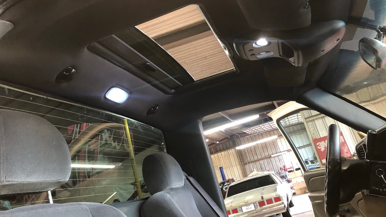 INSTALLING A SUNROOF ON MY 2004 GMC SINGLE CAB AND BLACKING OUT MY ...