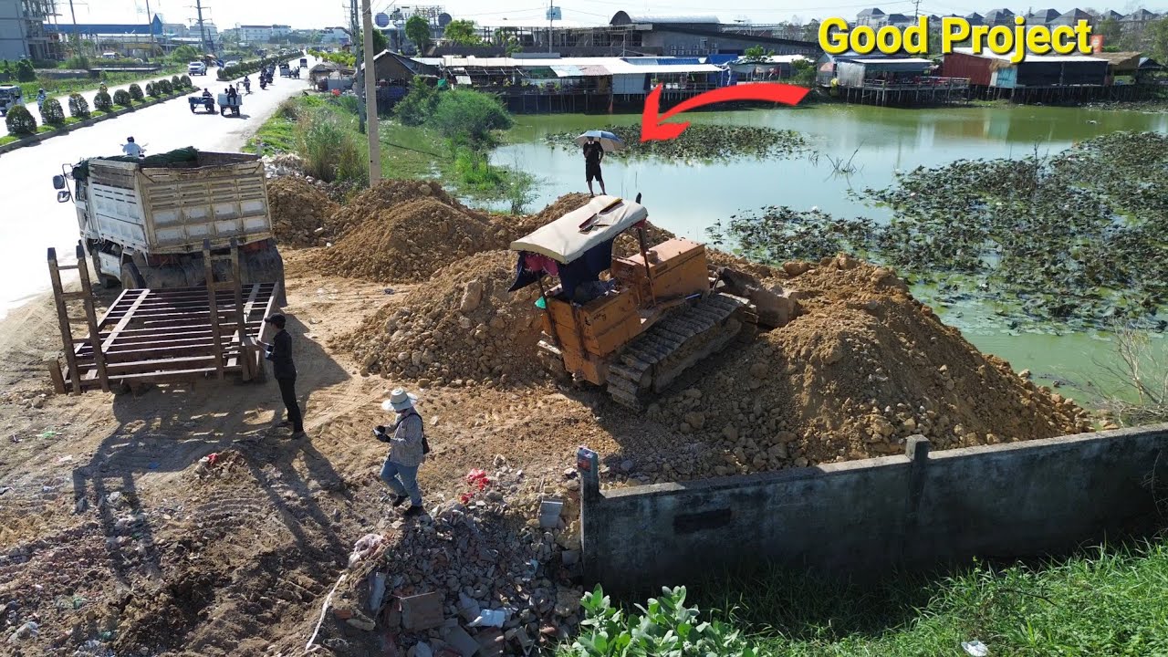 Excellent Skill with great Dozer KOMATSU D30P filling up over the Swamp ...