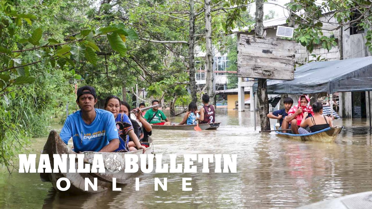 Despite chest-deep flooding, Residents continue their daily activities ...