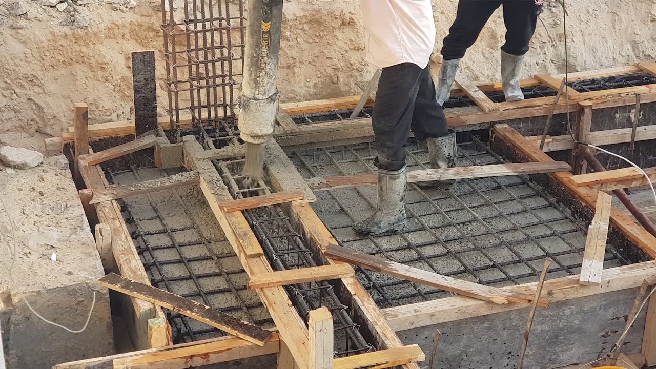 House foundation reinforced strap footing concrete pour - YouTube