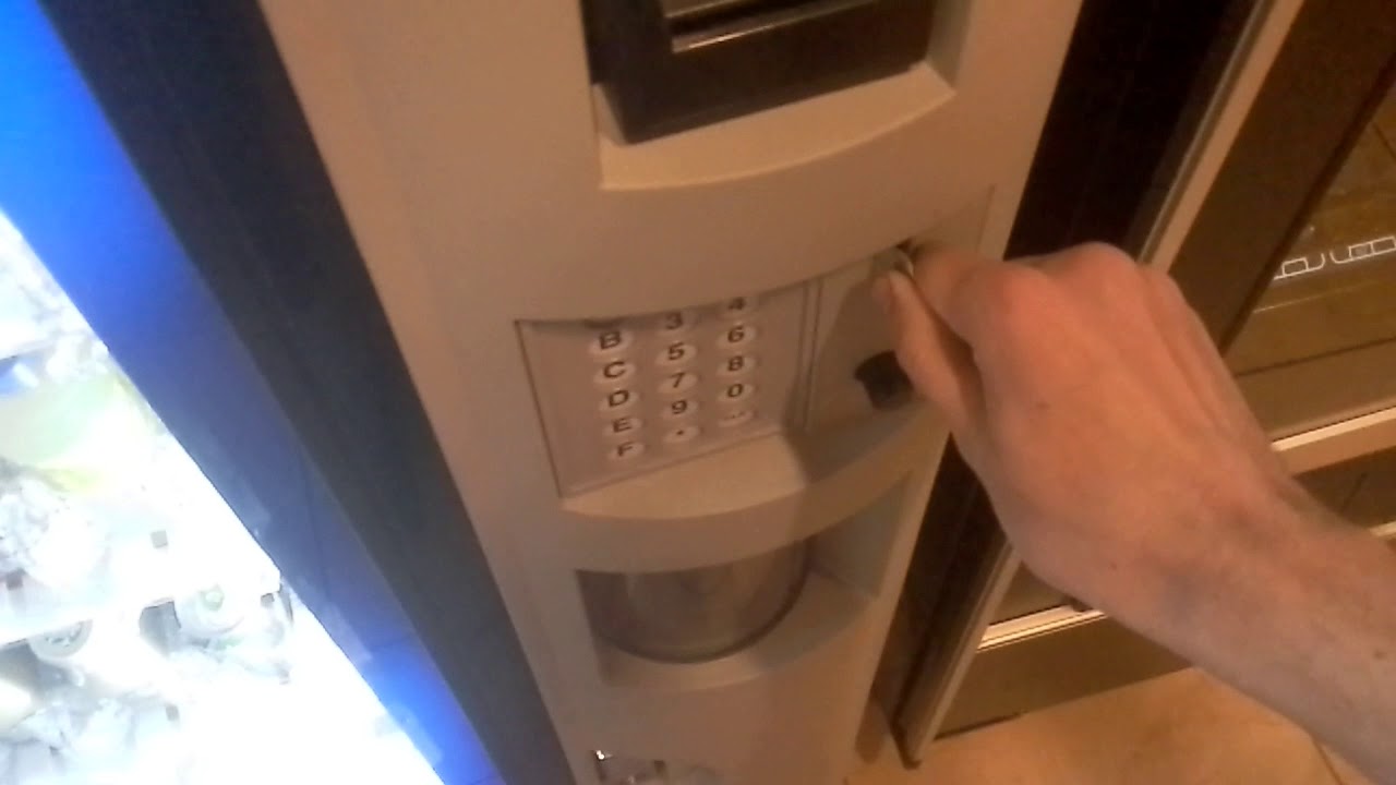 Getting a bottle of soda is diet pepsi from the soda machine robot with ...