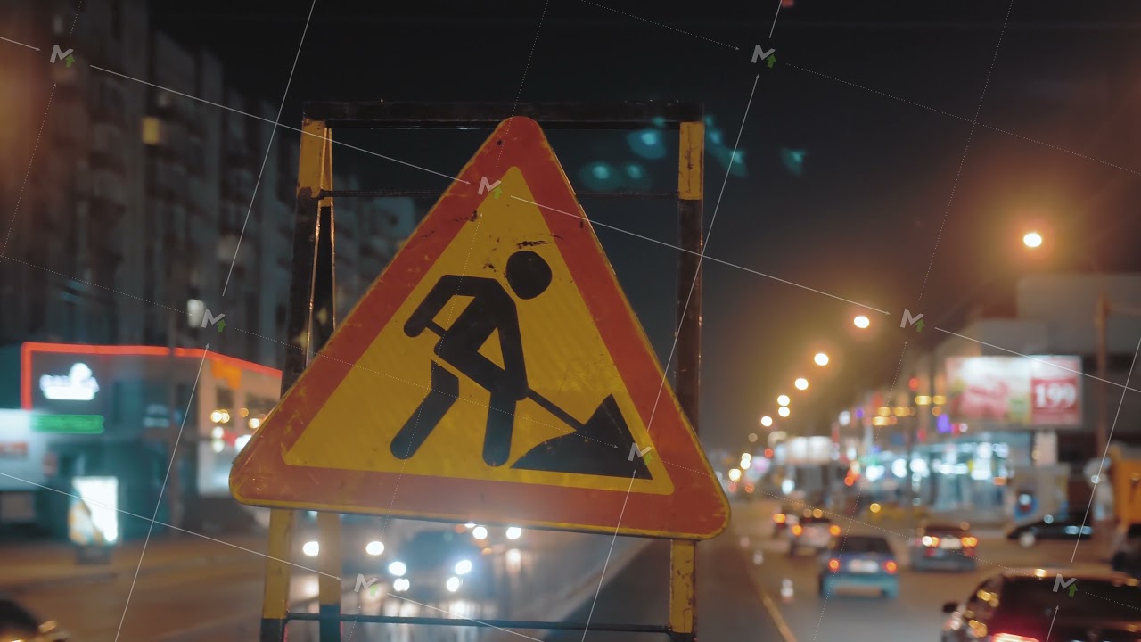 Close-up of a road sign warning drivers about road works. Grunge road ...