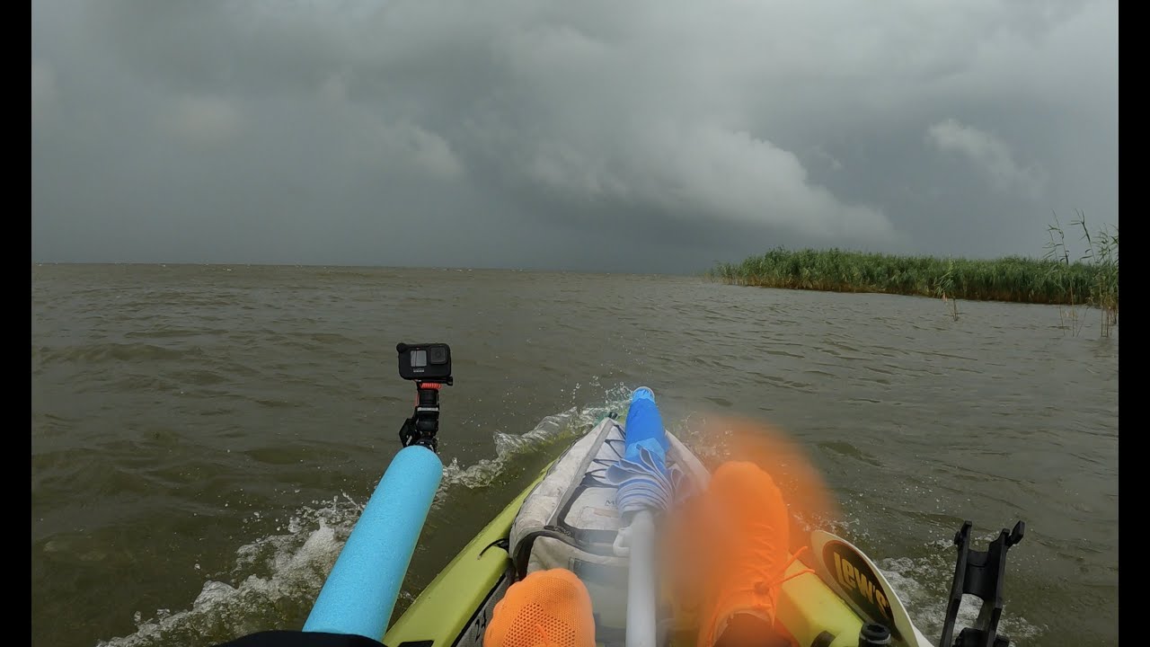 Kayaker gets caught in bad weather while fishing - YouTube