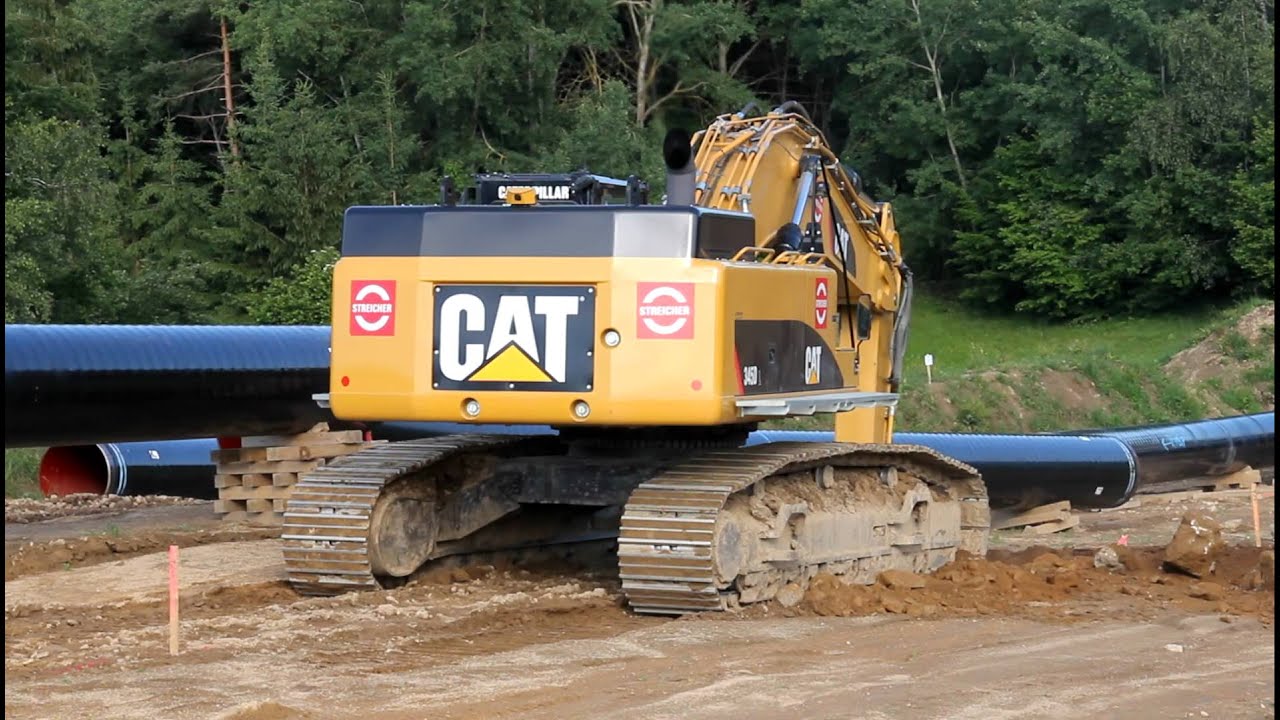 Caterpillar CAT 345D L digging a trench for a gas pipeline - YouTube