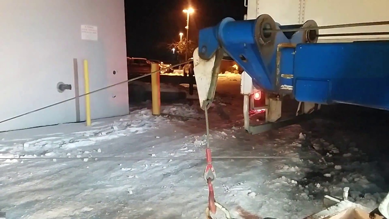 Semi winched out with an F-350 and a Holmes 1201 - YouTube