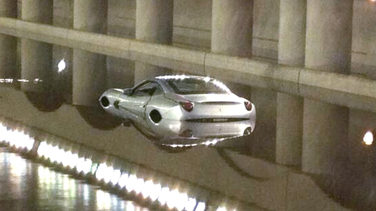 Video of the $300,000 Ferrari stuck in Toronto flood, man holes over ...