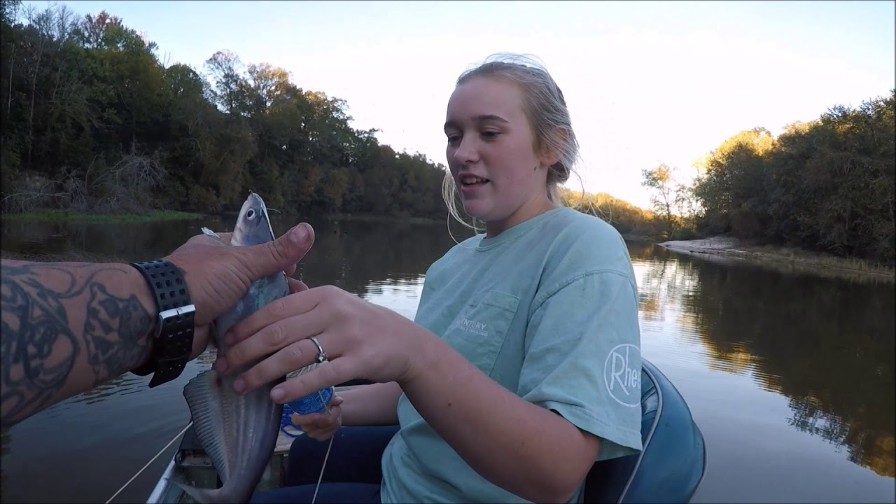 Teaching my daughter to run trot lines (her first fish) - YouTube