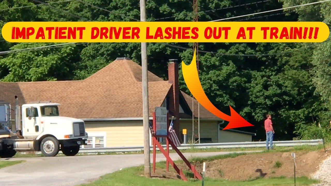 IMPATIENT truck driver LASHES out at trains BLOCKING the crossing on ...