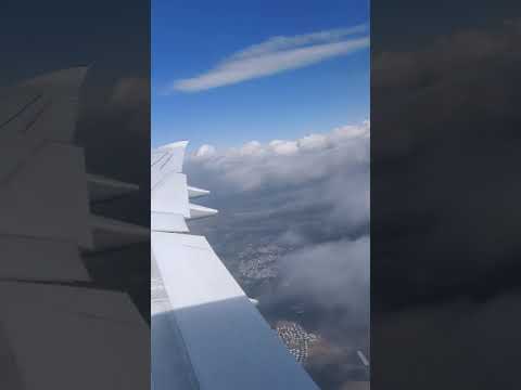Plane hovering just above clouds - YouTube