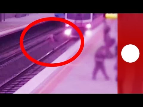Crazy near miss: Man runs across 2 train tracks, Australia - YouTube