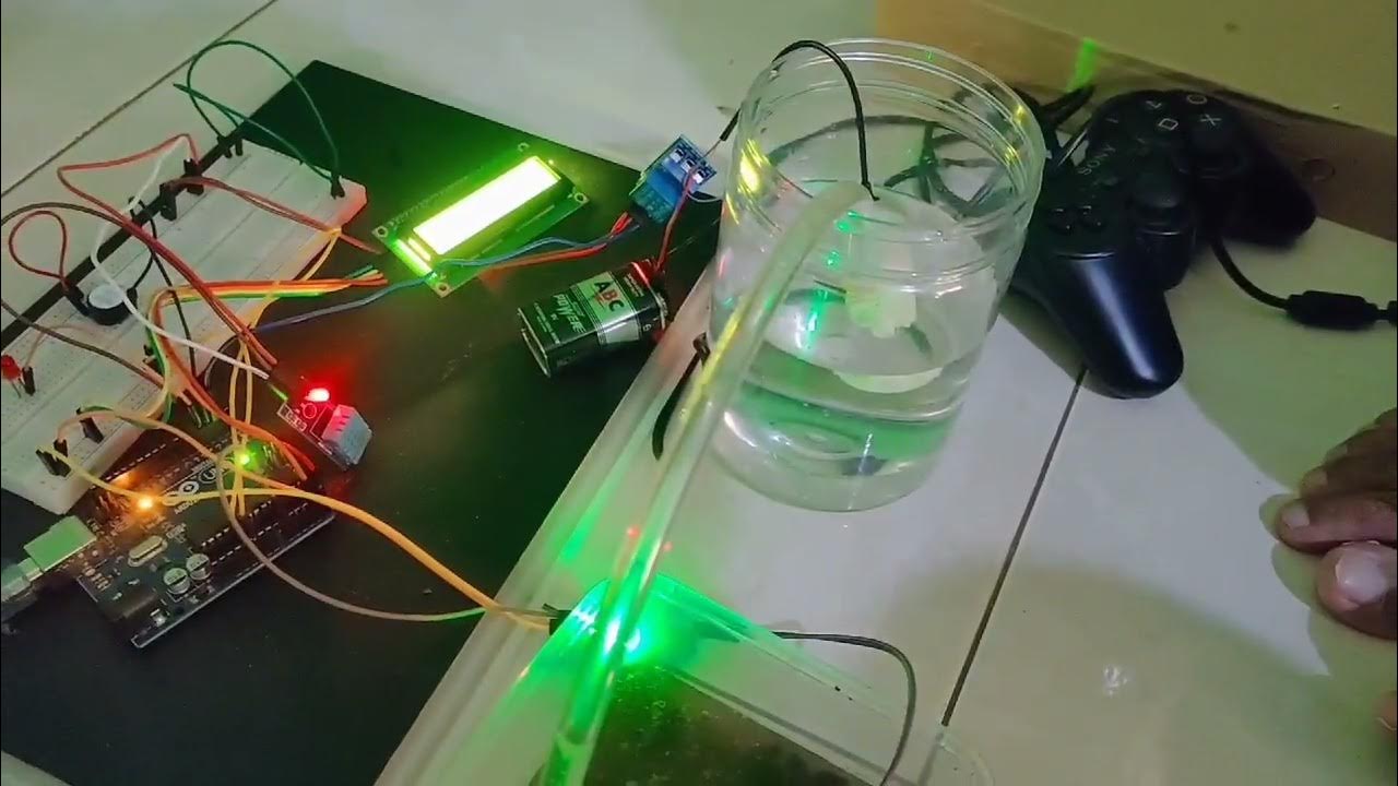 TUGAS BESAR DASAR MIKRO PENGENDALI (Alat penyiram tanaman otomatis ...