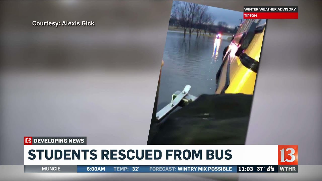 Students rescued from bus stuck in water - YouTube