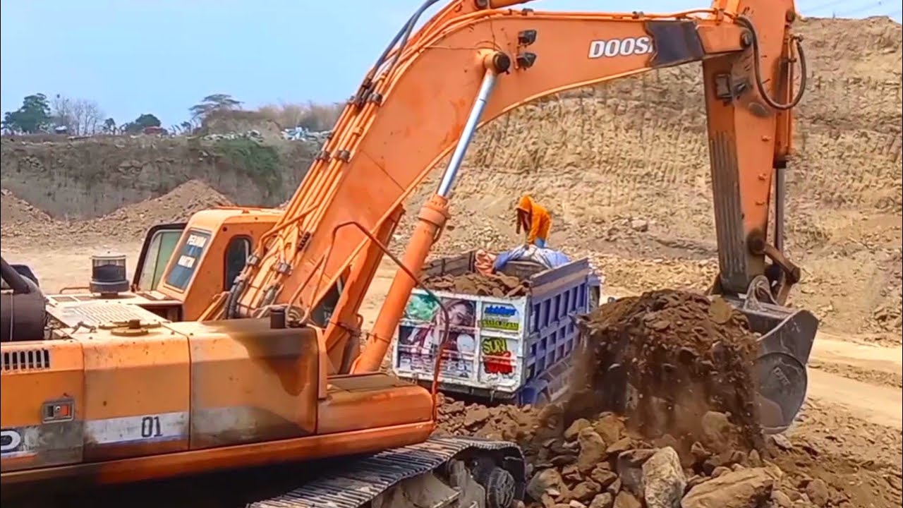 Excavators Loading Dump Trucks Digging Limestone on Road Construction ...