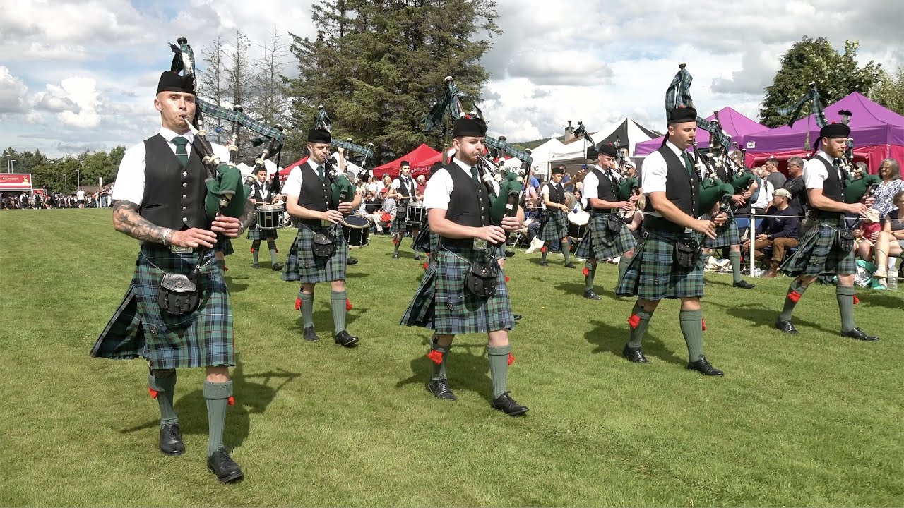 Pipe Major Cooper leads Ballater Pipe Band on the march during 2023 ...