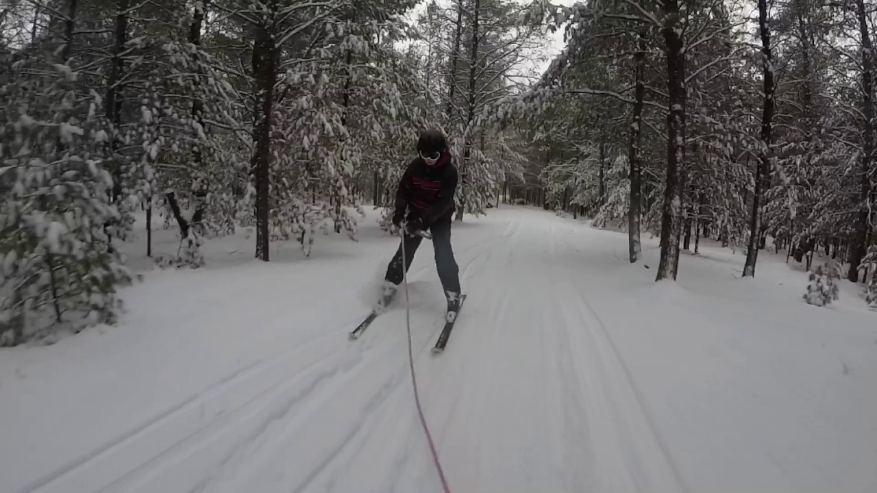 INSANE SKIING BEHIND SNOWMOBILE (KID ALMOST HITS TREE) - YouTube