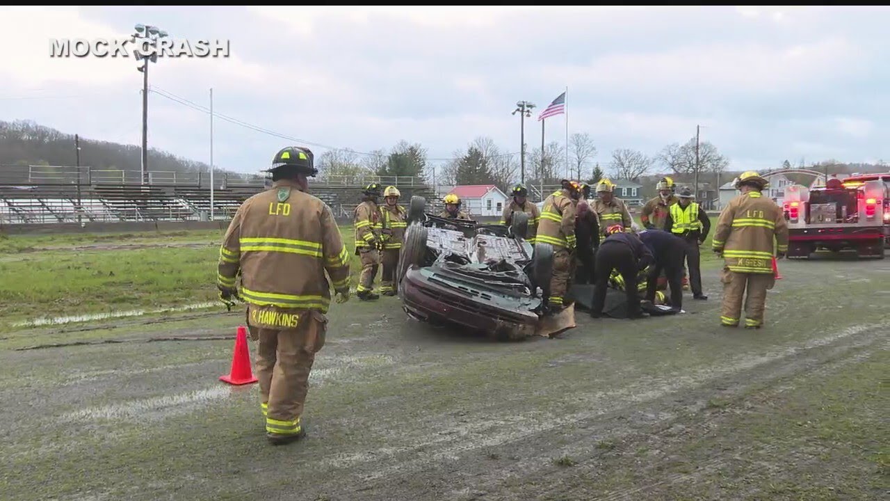 High school students participate in mock car crash with first ...