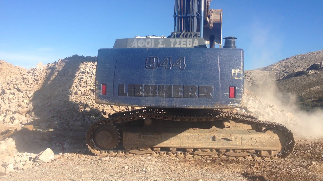 Two liebherr 944 excavators dig a wind turbine base in Greece. - YouTube