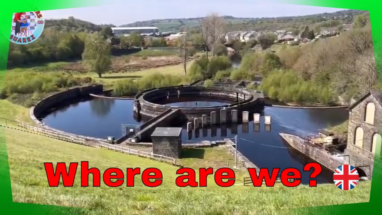 A couple walk in Hadfield and Padfield trail enjoying nature views a ...