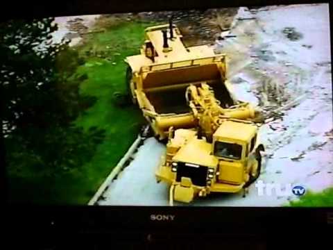 Bulldozer Coverted to Tank Fires and Crushes Colorado town over Land ...