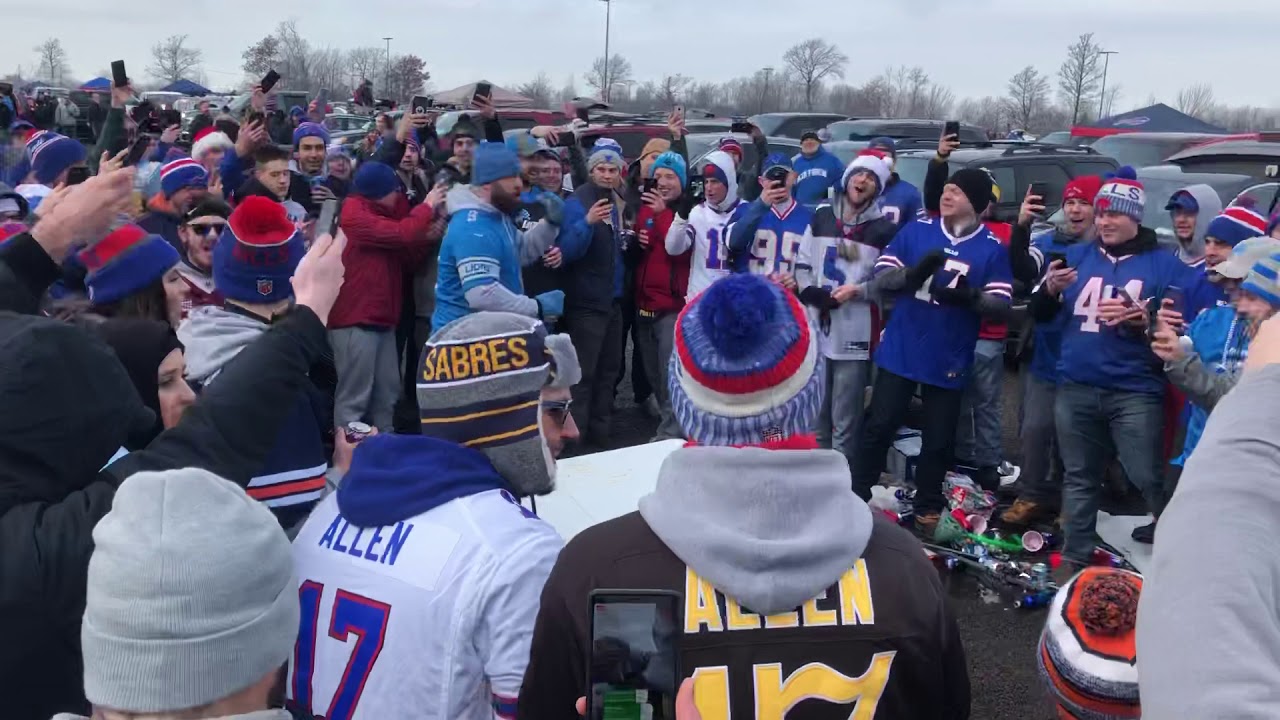 Bills fan smashes table with help from Lions fan !!! - YouTube