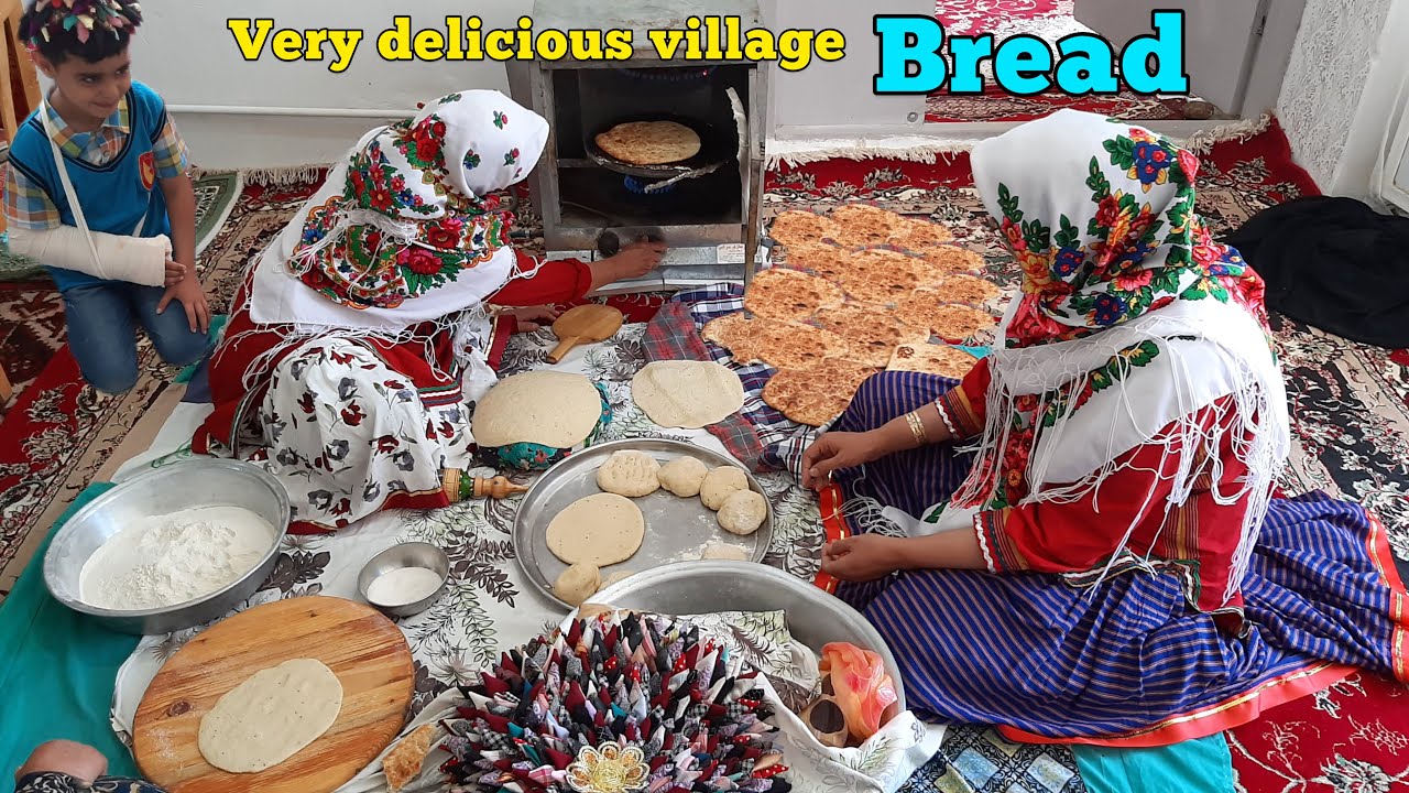 Traditional delicious bread recipe baking by village women in the oven ...