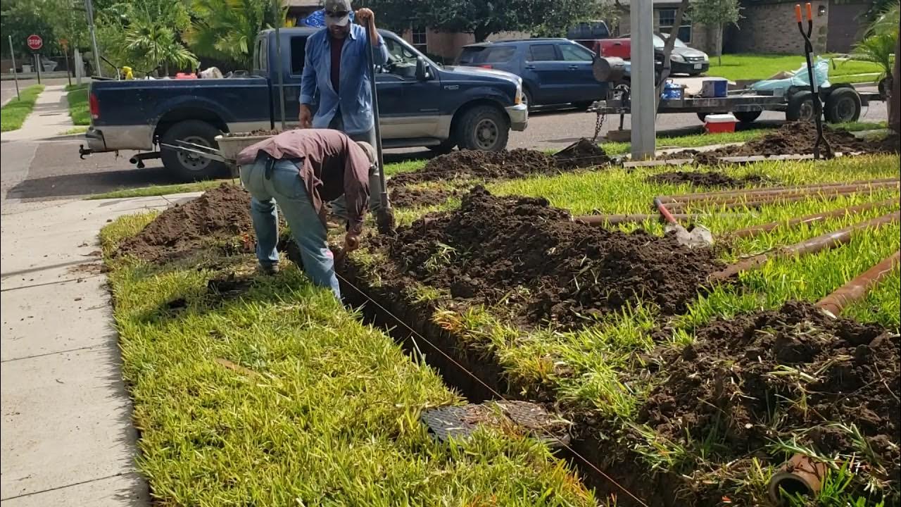 Hand digging trench and holes for concrete footing and columns - YouTube