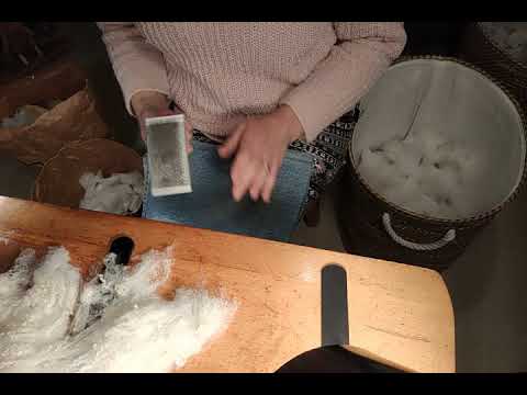 Demonstration of flick carding a soft Shetland fleece - YouTube