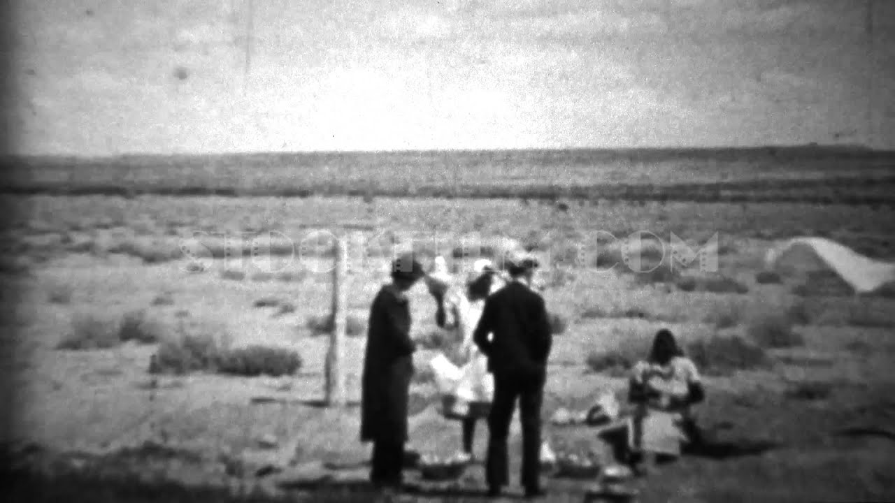 1938: Depression era homeless people selling wares roadside. BAKER ...