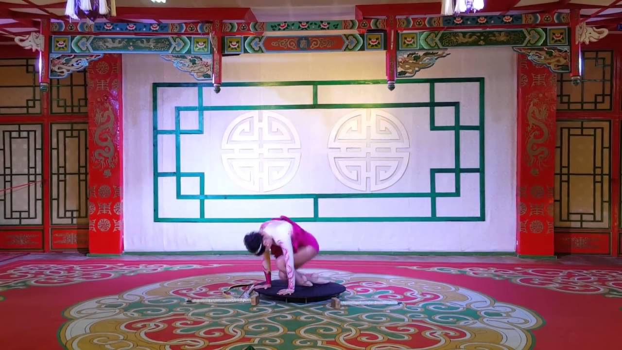 Solo Contortion with archery - YouTube