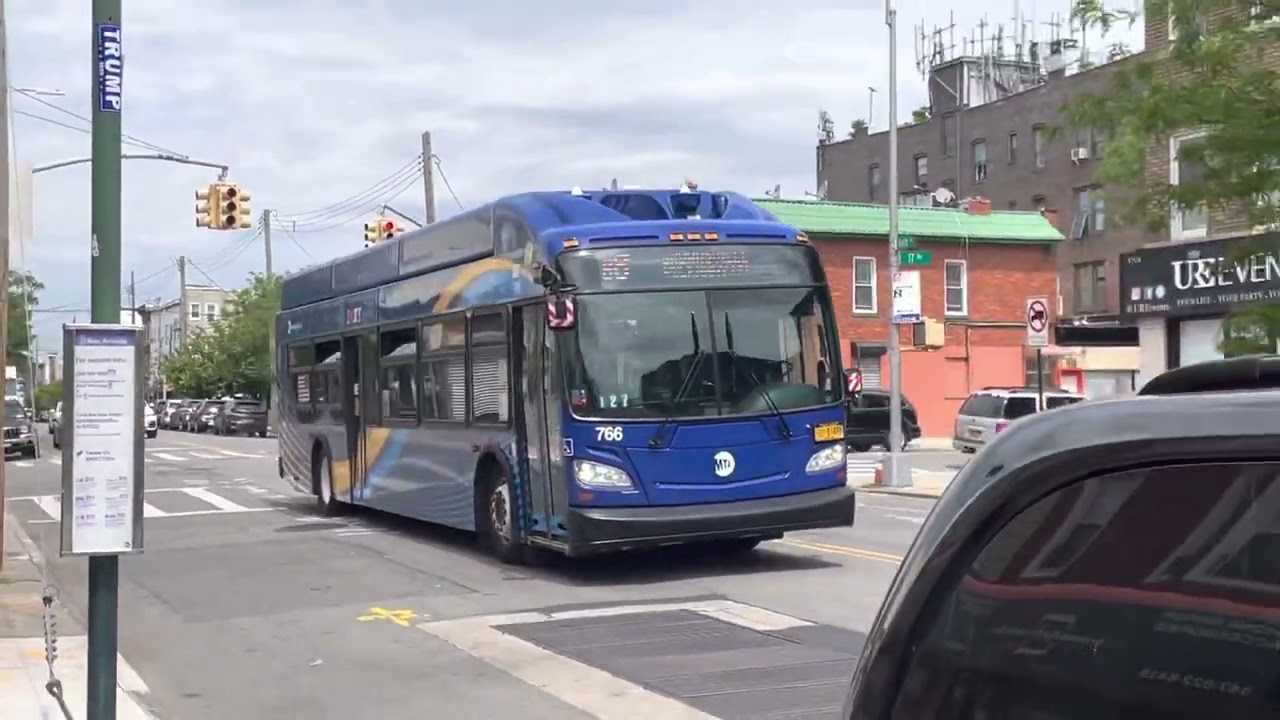 MTA NYC Bus • 2017 XN40 #766 B8 Bus passing Bath Ave & 17 Ave (5/28/21 ...