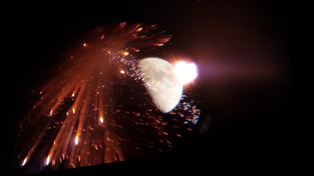 Fireworks exploding in front of the Moon - YouTube