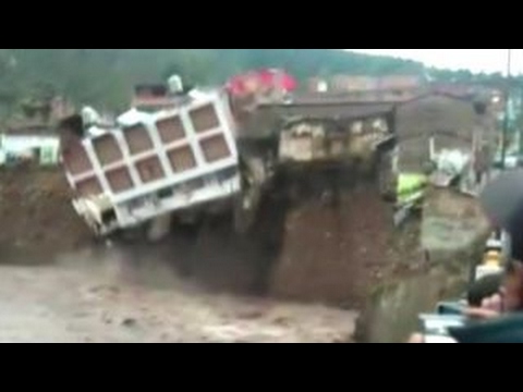Dramatic hotel collapse into river caught on tape - YouTube