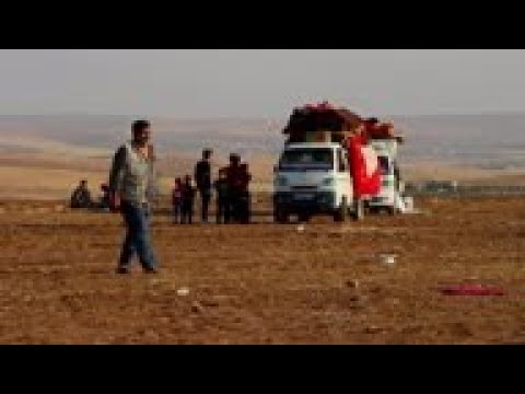 Displaced Syrian families camping outside Kobani