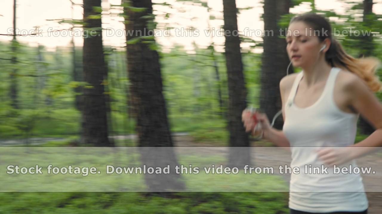 Young woman running in the morning in the forest, slow motion - YouTube