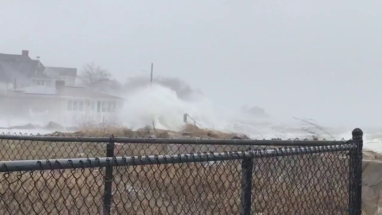 Huge waves crash into homes during nor'easter - YouTube