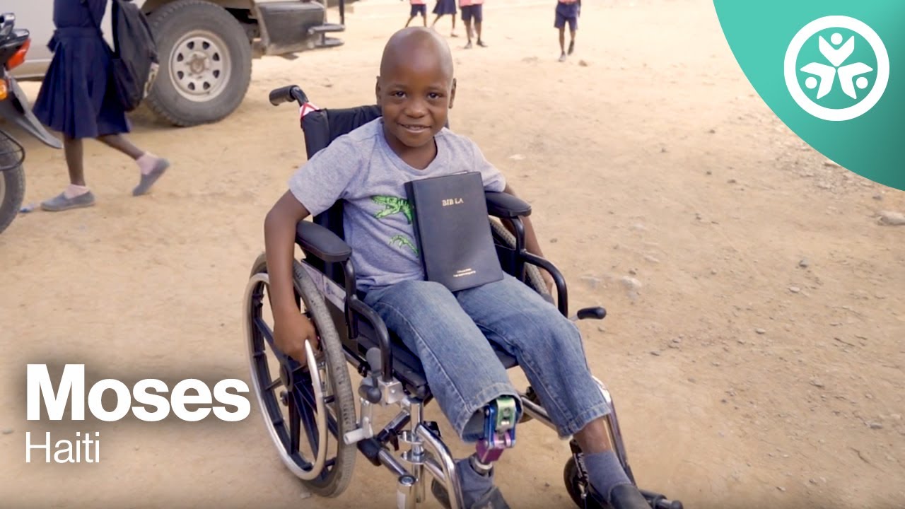 Moses Receives a Wheelchair from Wheels for the World - YouTube