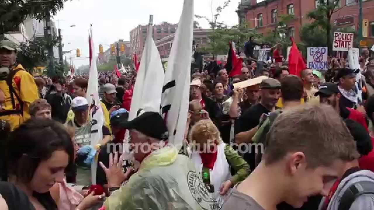 People chanting at protest with riot police in line - HD 1080p - YouTube