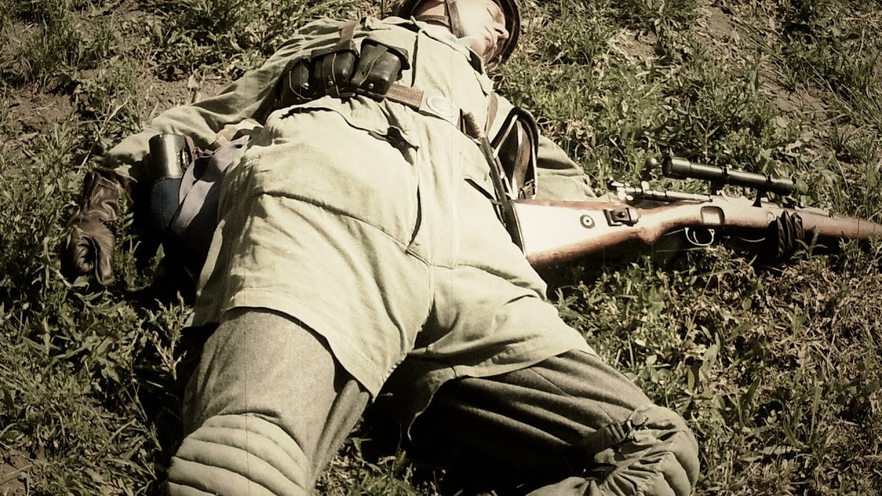 Second world war reconstruction, body of dead soldier on earth. Soviet ...