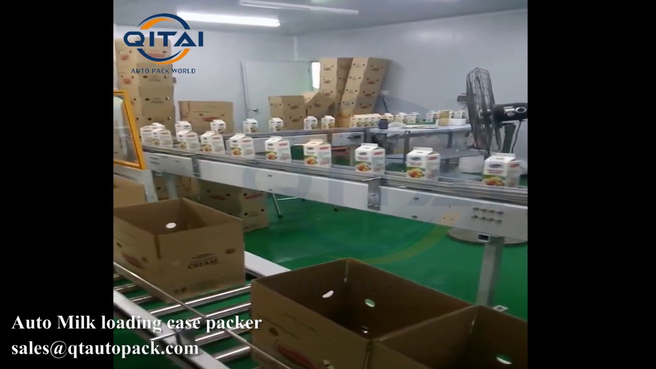 Auto milk loading case packer line Food packaging equipment auto case packer - YouTube